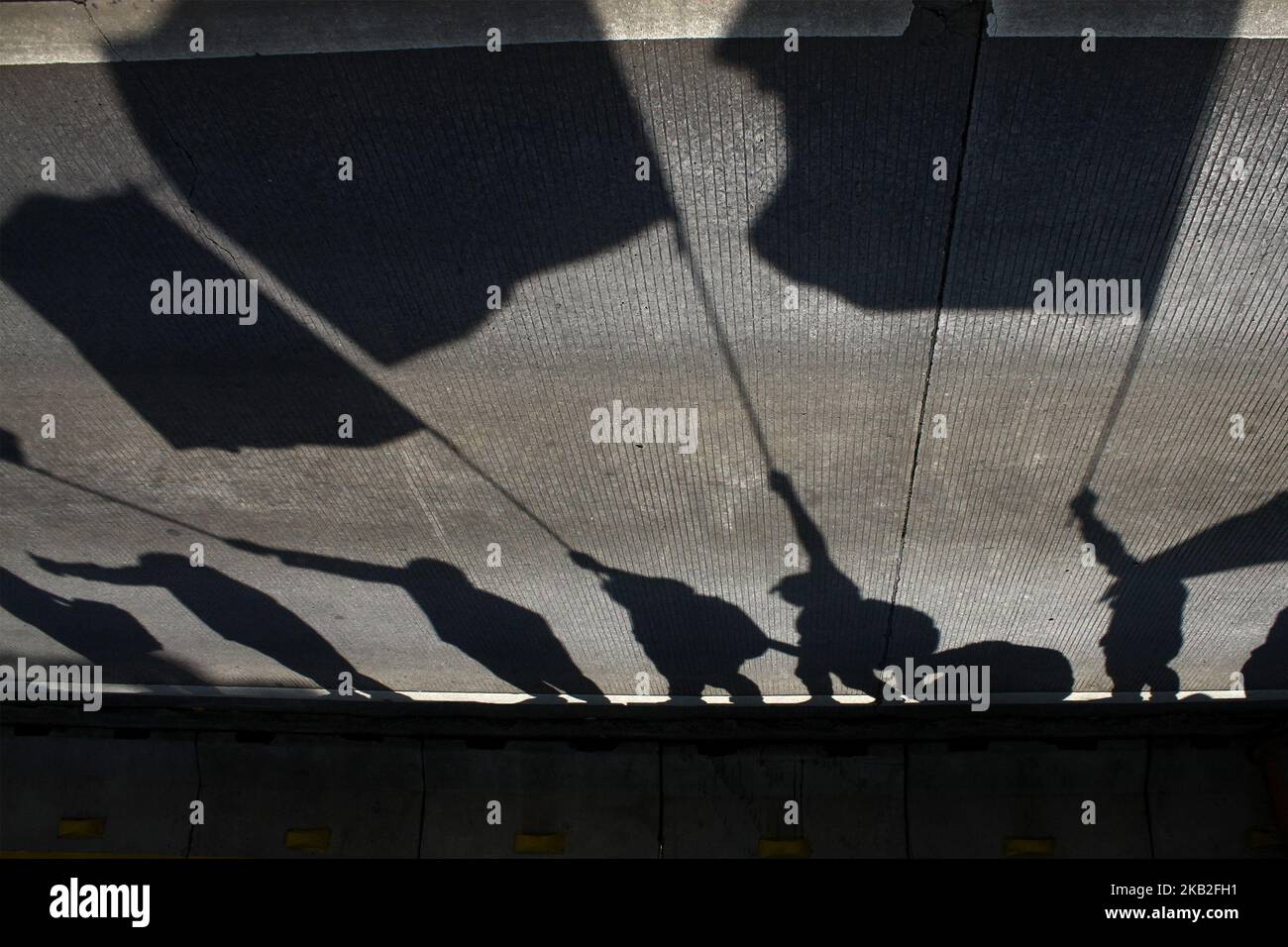 Indonesian Muslims carrying Tawheed flags and other attributes staged ...