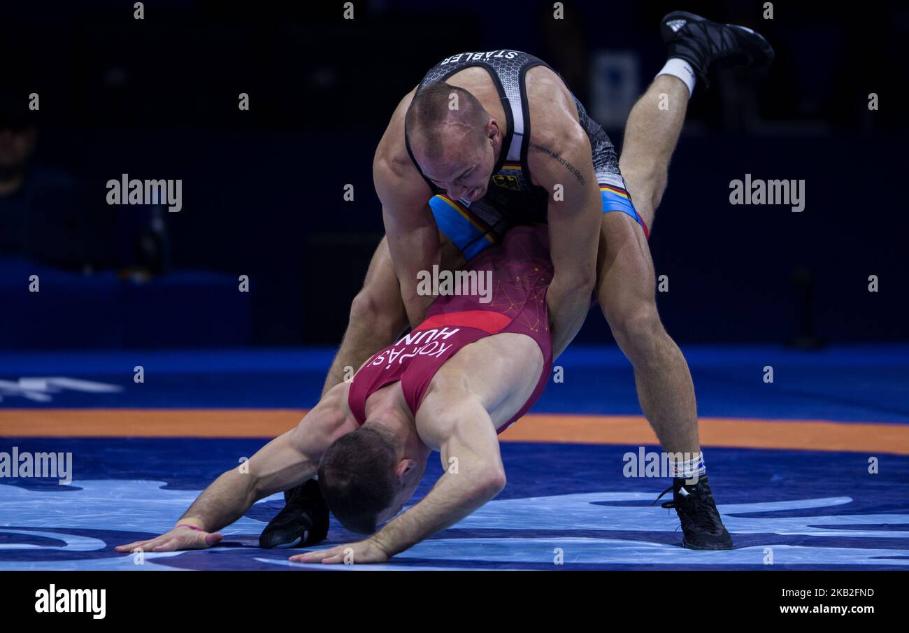 Hungary’s Balint Korpasi and Germany’s Frank Staebler compete during ...