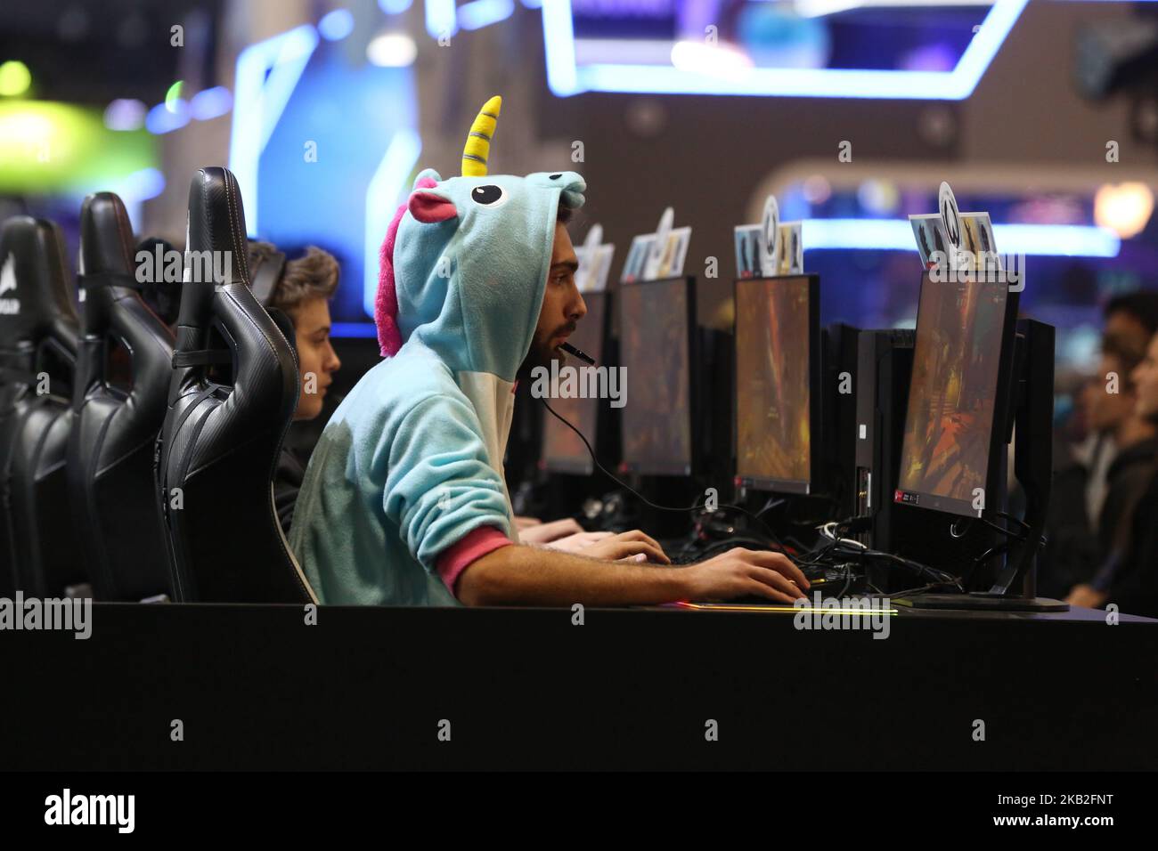 A gamer wearing disguise plays video game in October 26, 2018, during ...