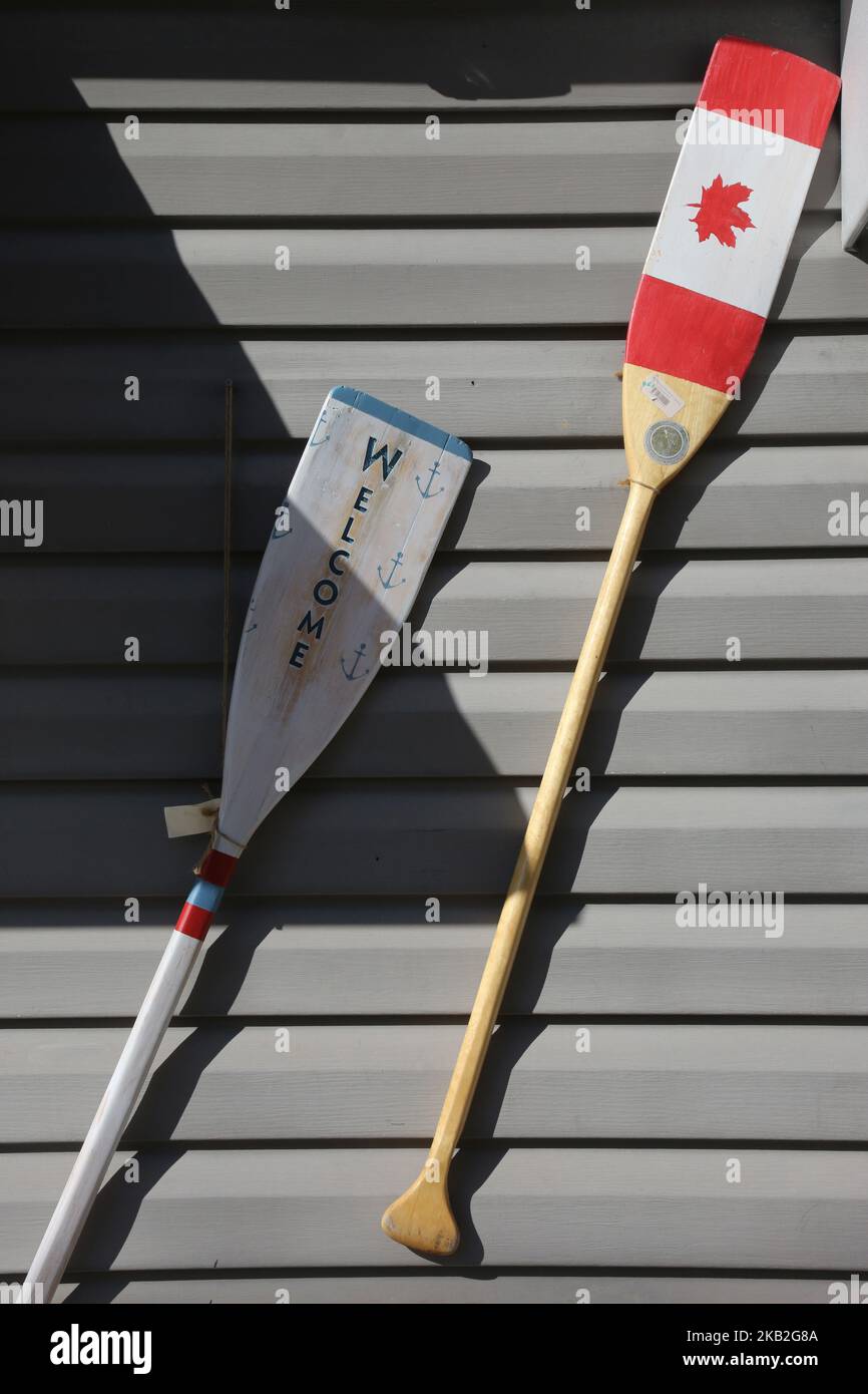 Wooden oars on the side of a building in Jackson Point, Ontario, Canada ...
