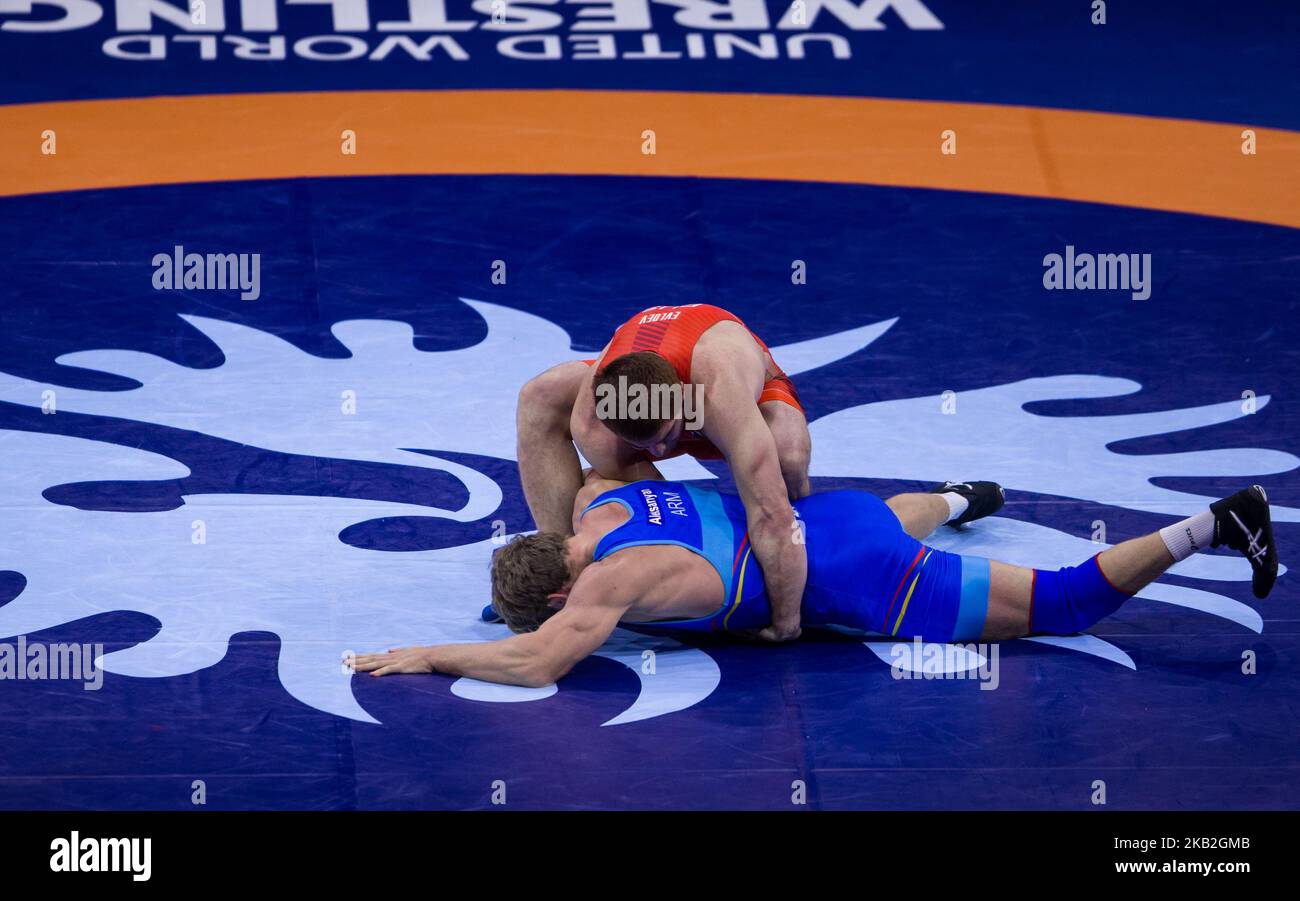 Armenian’s Aleksanyan Artur and Russian’s Evloev Musa compete during ...