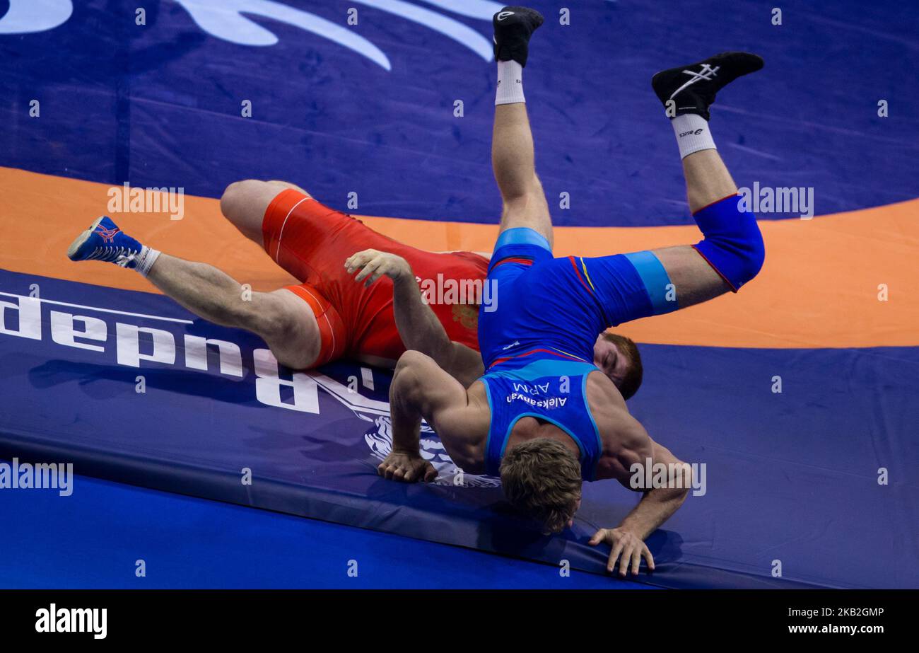 Armenian’s Aleksanyan Artur and Russian’s Evloev Musa compete during ...