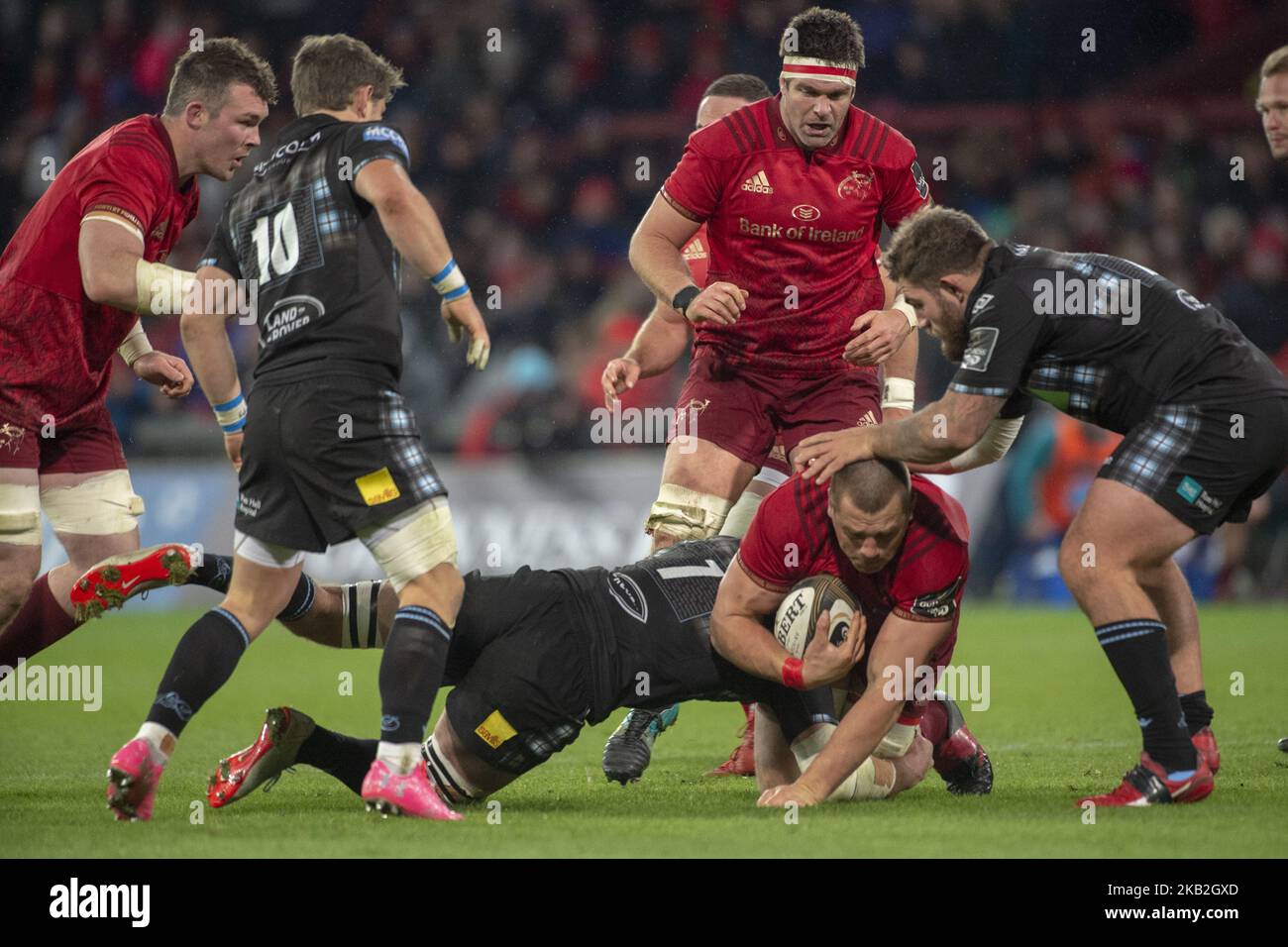 CJ Stander of Munster with the ball tackled by Callum Gibbins of ...