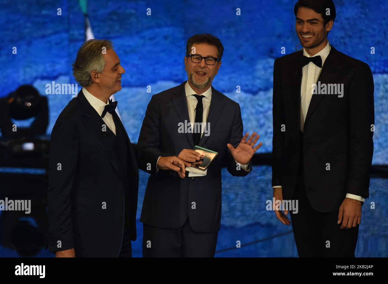 Fabio Fazio (C) and the great Italian singer Andrea Bocelli and his son ...