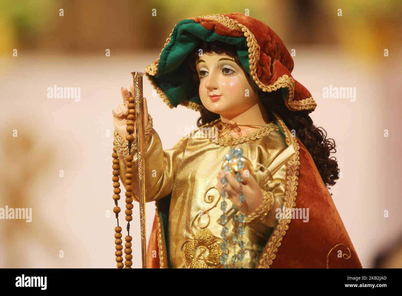 Close-up of a statue of Santo Niño waiting to be blessed during a ...