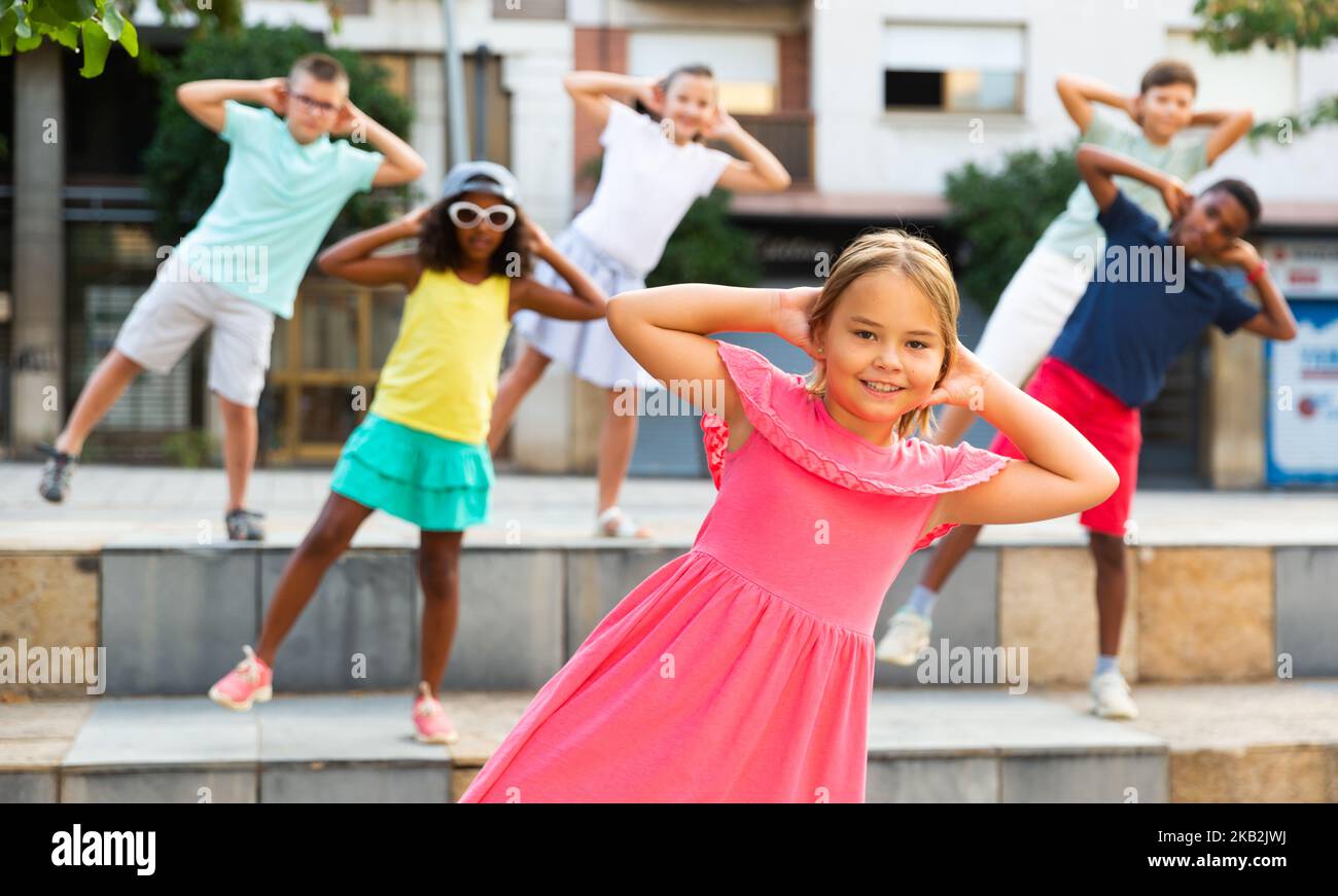 Group of kids performing street dance outdoors Stock Photo - Alamy