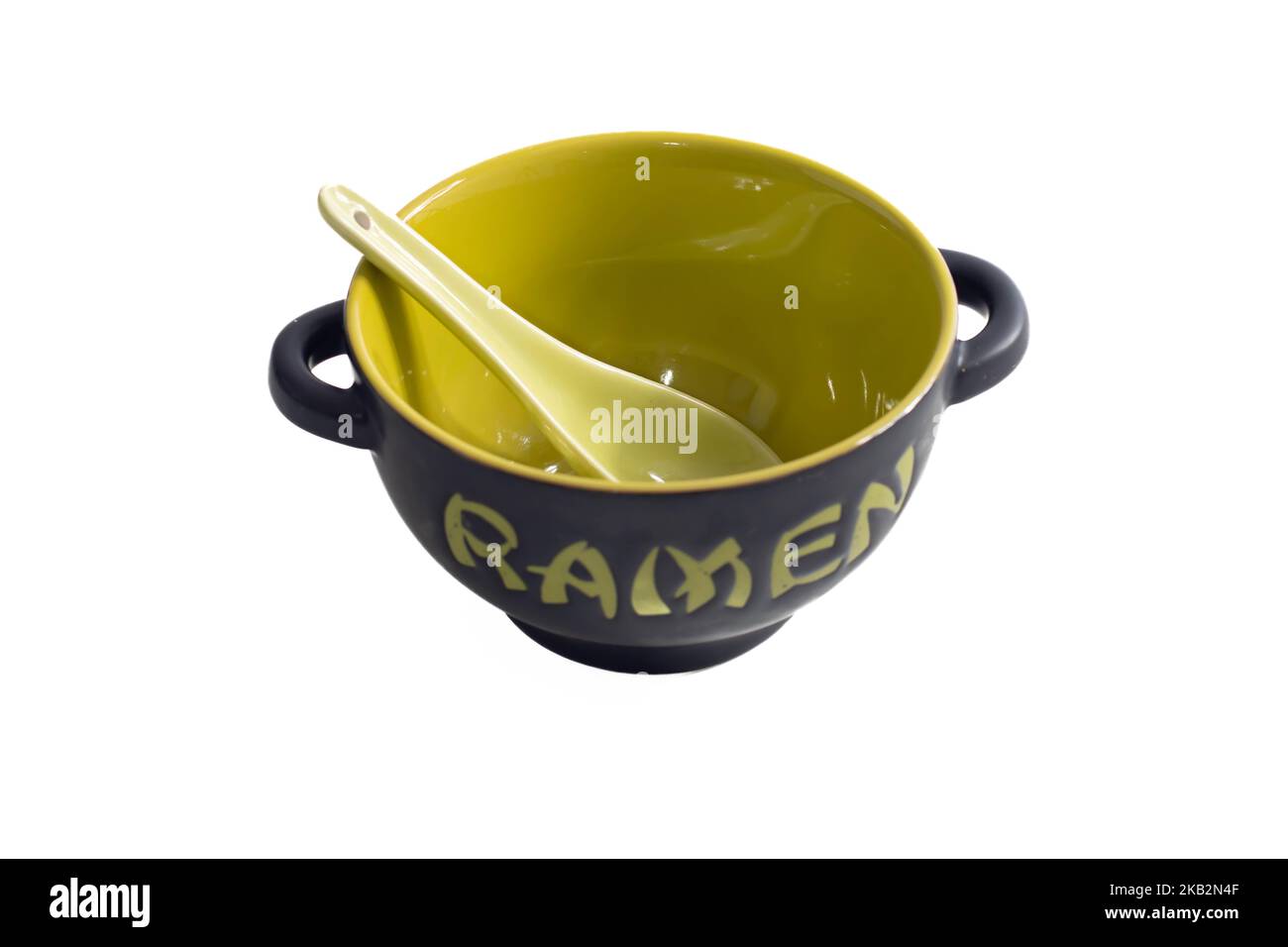 ramen bowl with sign and traditional ramen spoon inside on a white ...