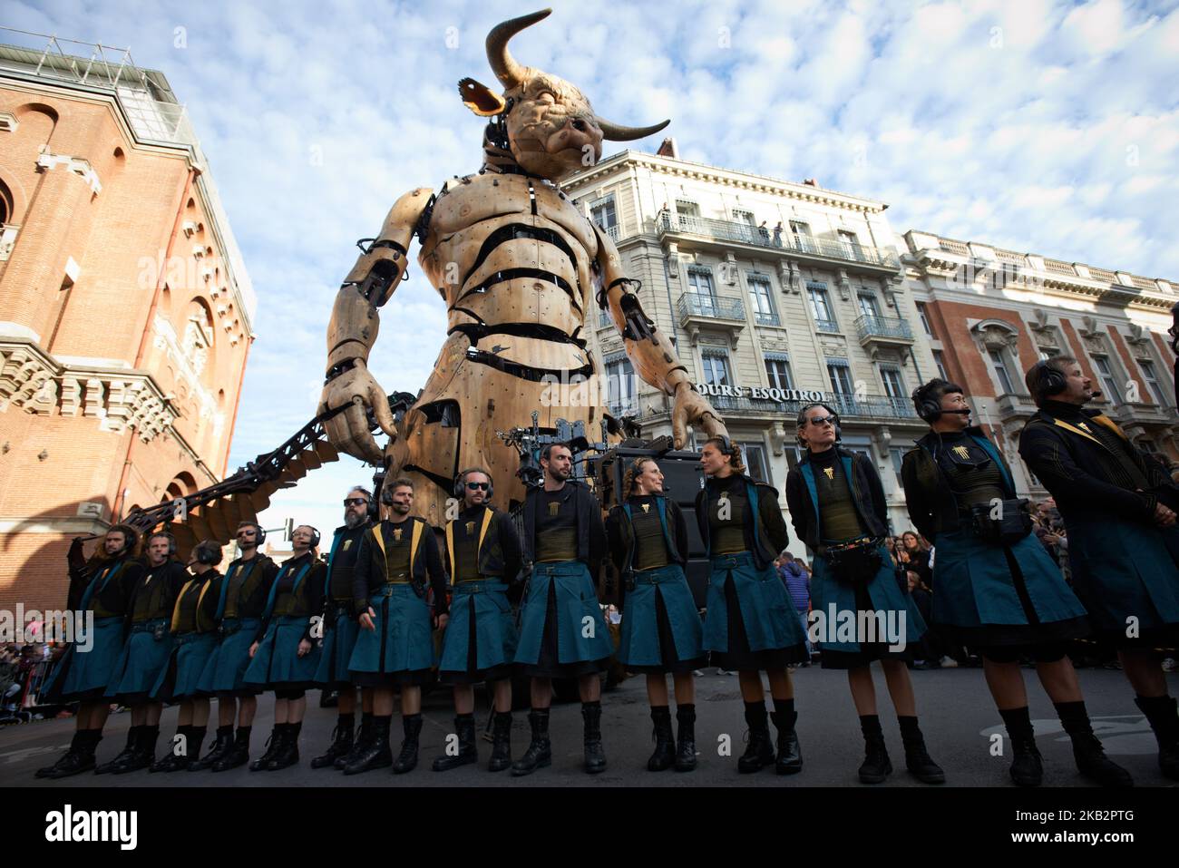 Manipulators of Asterion the Minotaur salute the public. Hundreds of ...