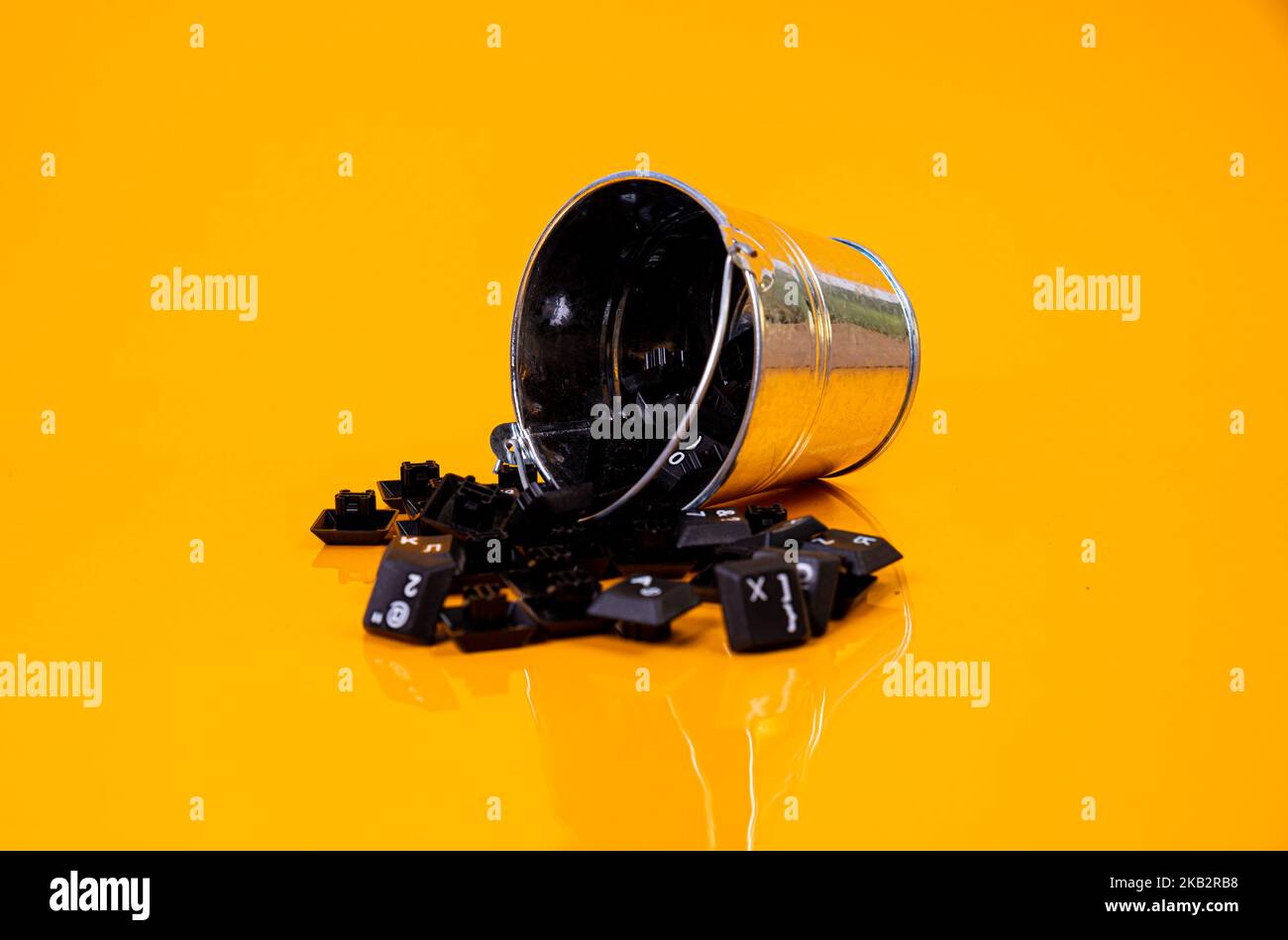 keyboard button in glass in jar in bucket on orange background isolated ...
