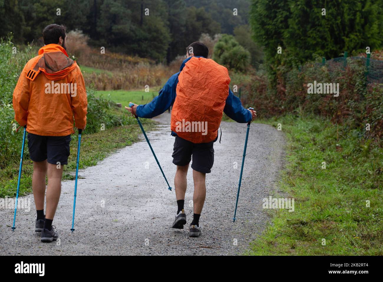 Two pilgrims on the Portuguese Camino de Santiago passing through Valga ...