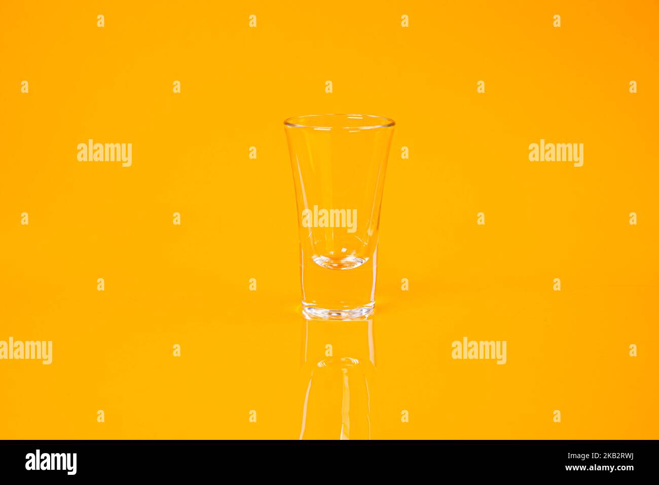 empty glass empty jar empty ice bucket on orange background top front ...