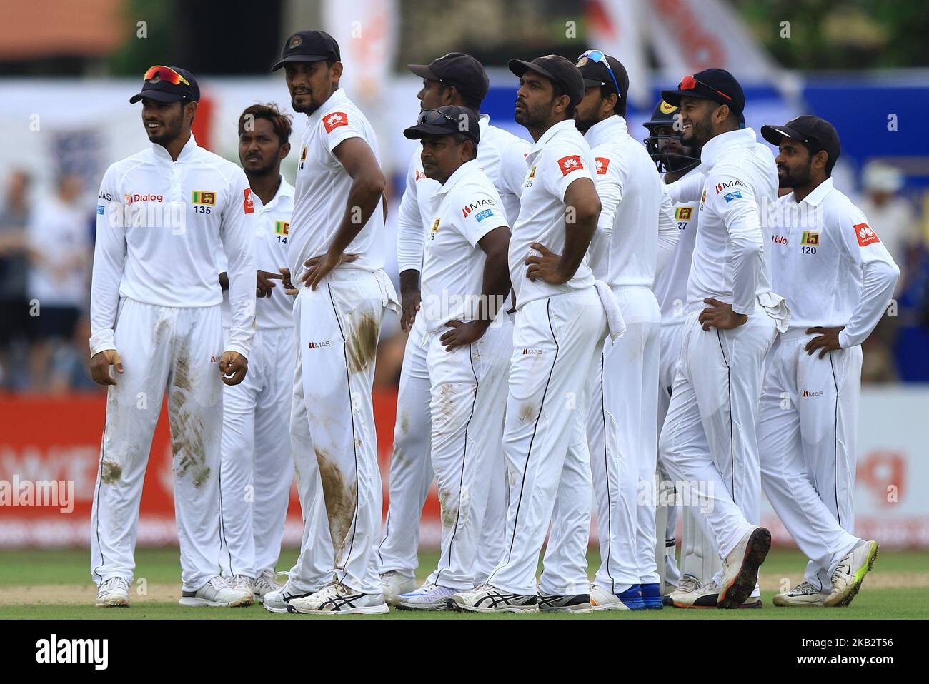 Sri Lankan cricketers look on for a 3rd Umpire's decision during the ...
