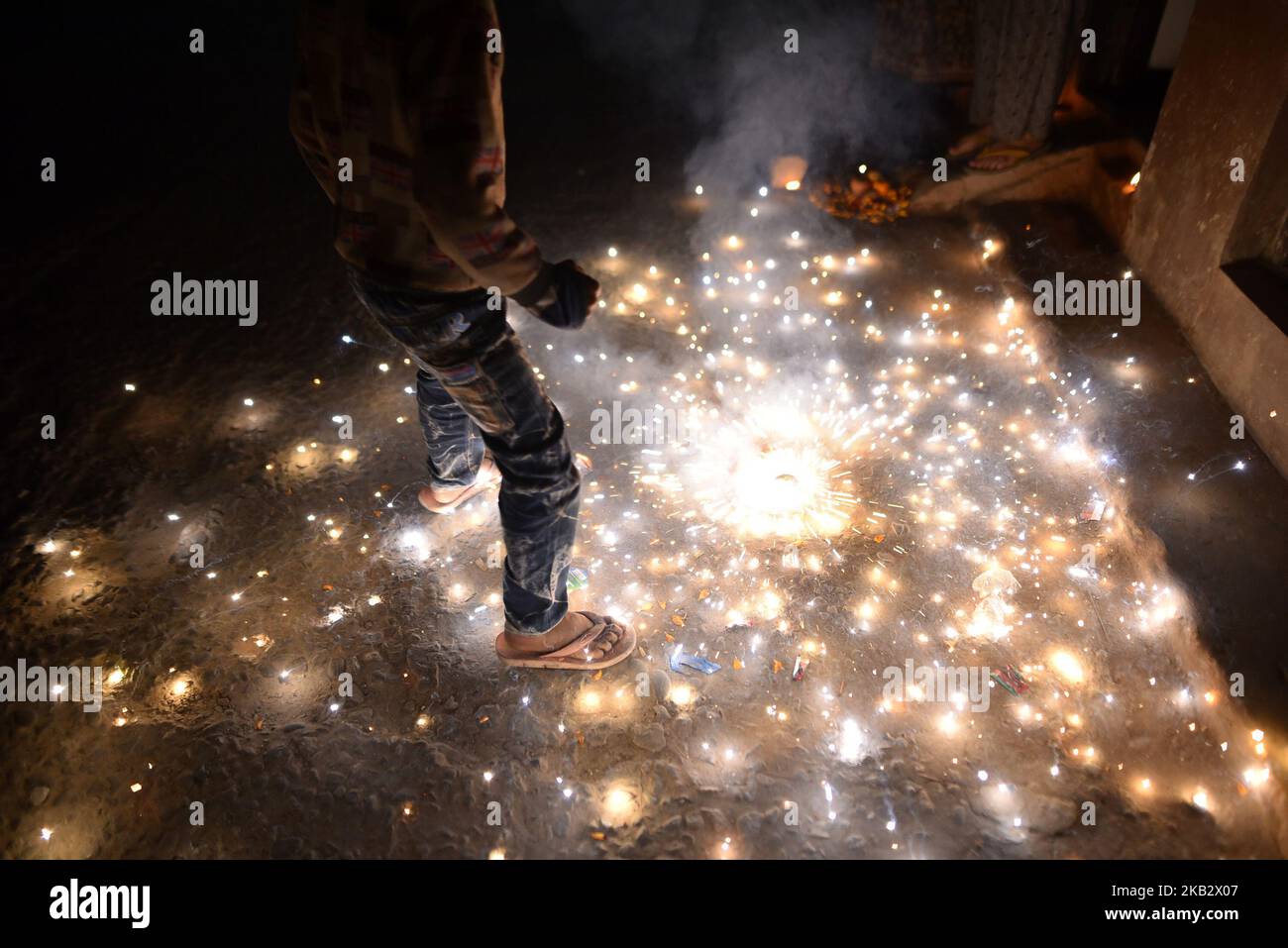 Nepalese kids playing with fire crackers during Laxmi Puja as the ...