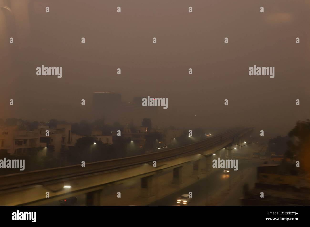 Buildings are seen shrouded in smog in Gurgaon, Haryana on 8 November ...