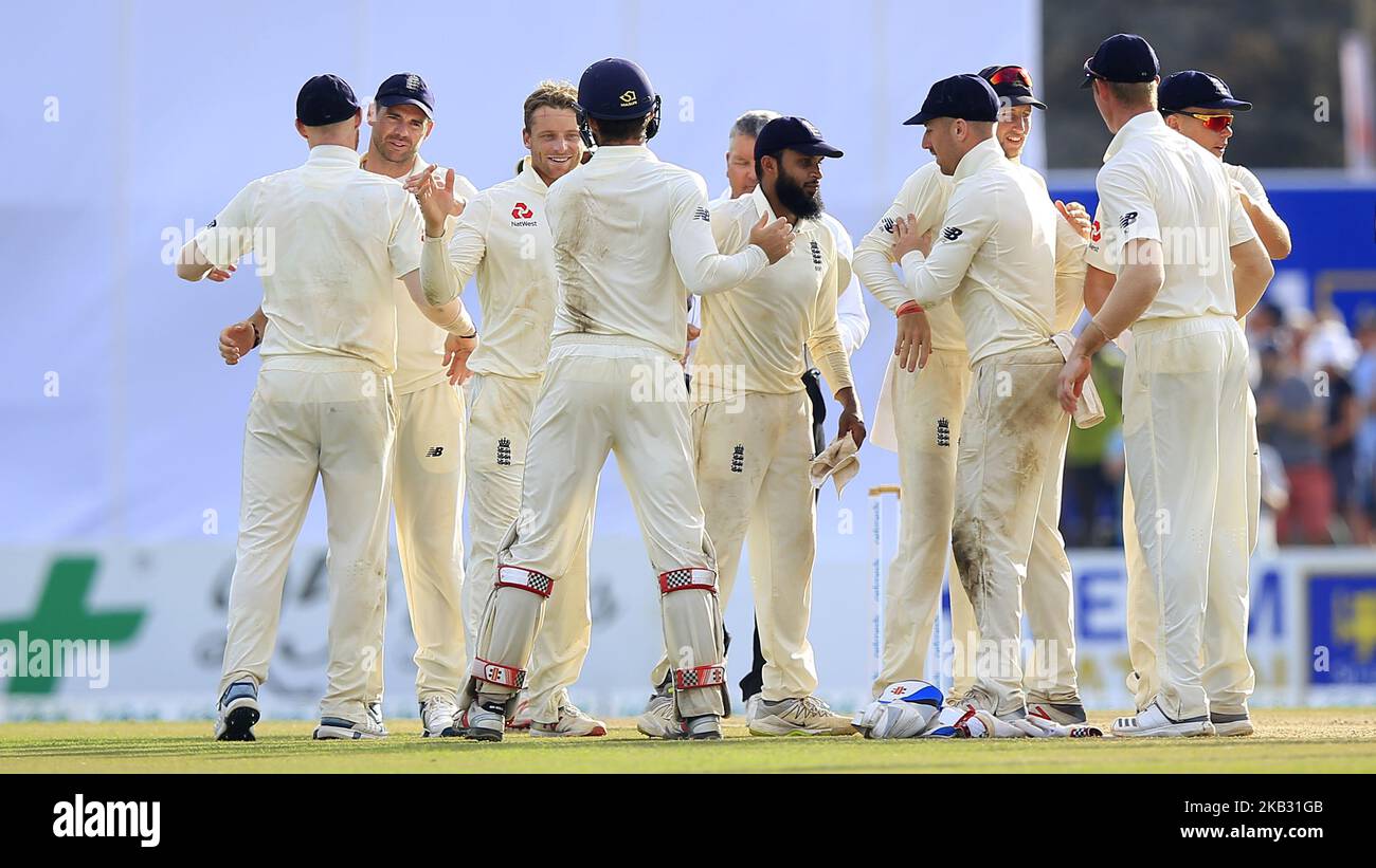 England cricketers led by captain Joe Root celebrate their victory over ...