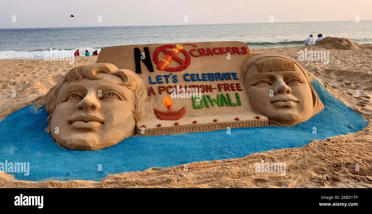 Sand sculpture is seen at the Bay of Bengal Sea's eastern coast beach ...