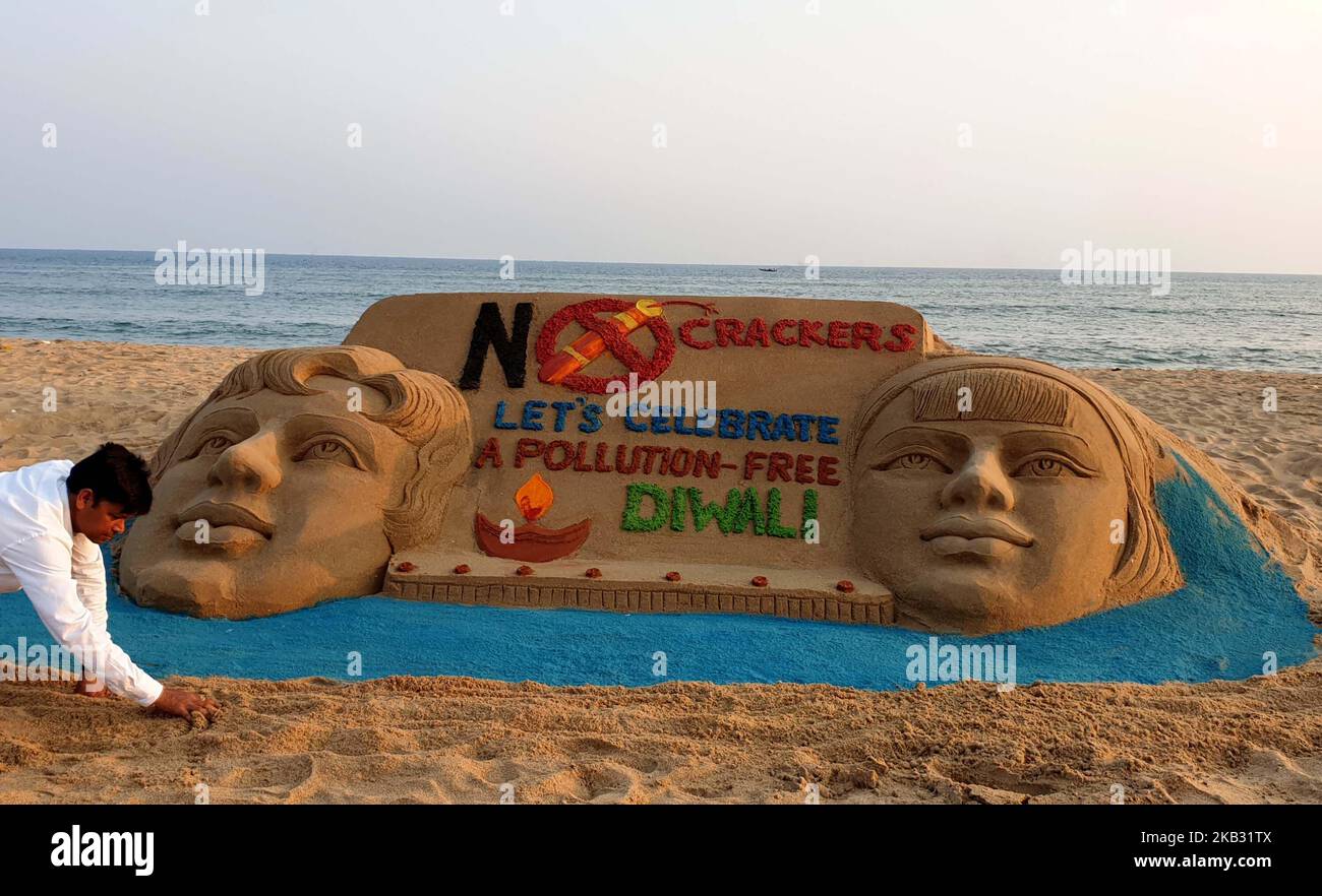 Sand sculpture is seen at the Bay of Bengal Sea's eastern coast beach ...