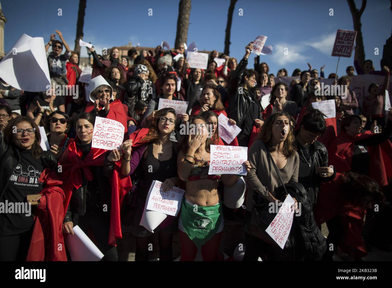 Women dressed as handmaidens stage a protest in downtown Rome on ...