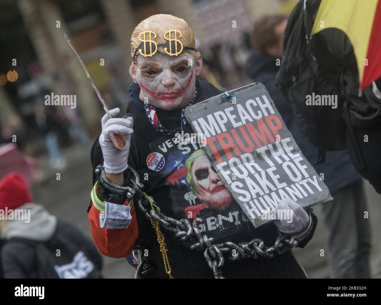 A man dressed up as the movie character 'the joker' with the hair style ...