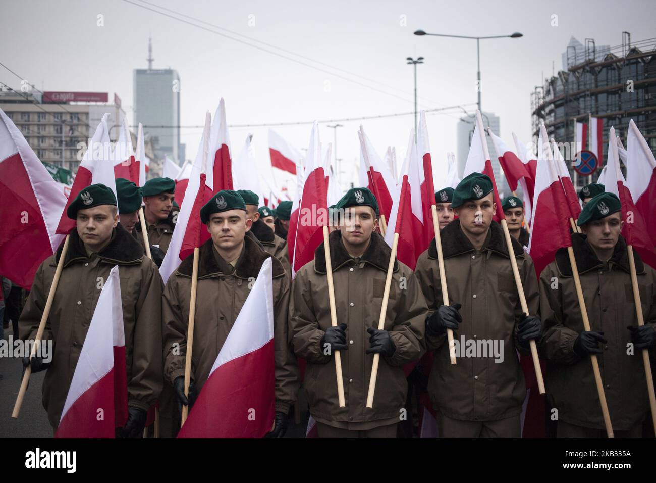 Polish soliders hold national flags during nationalistic March of ...