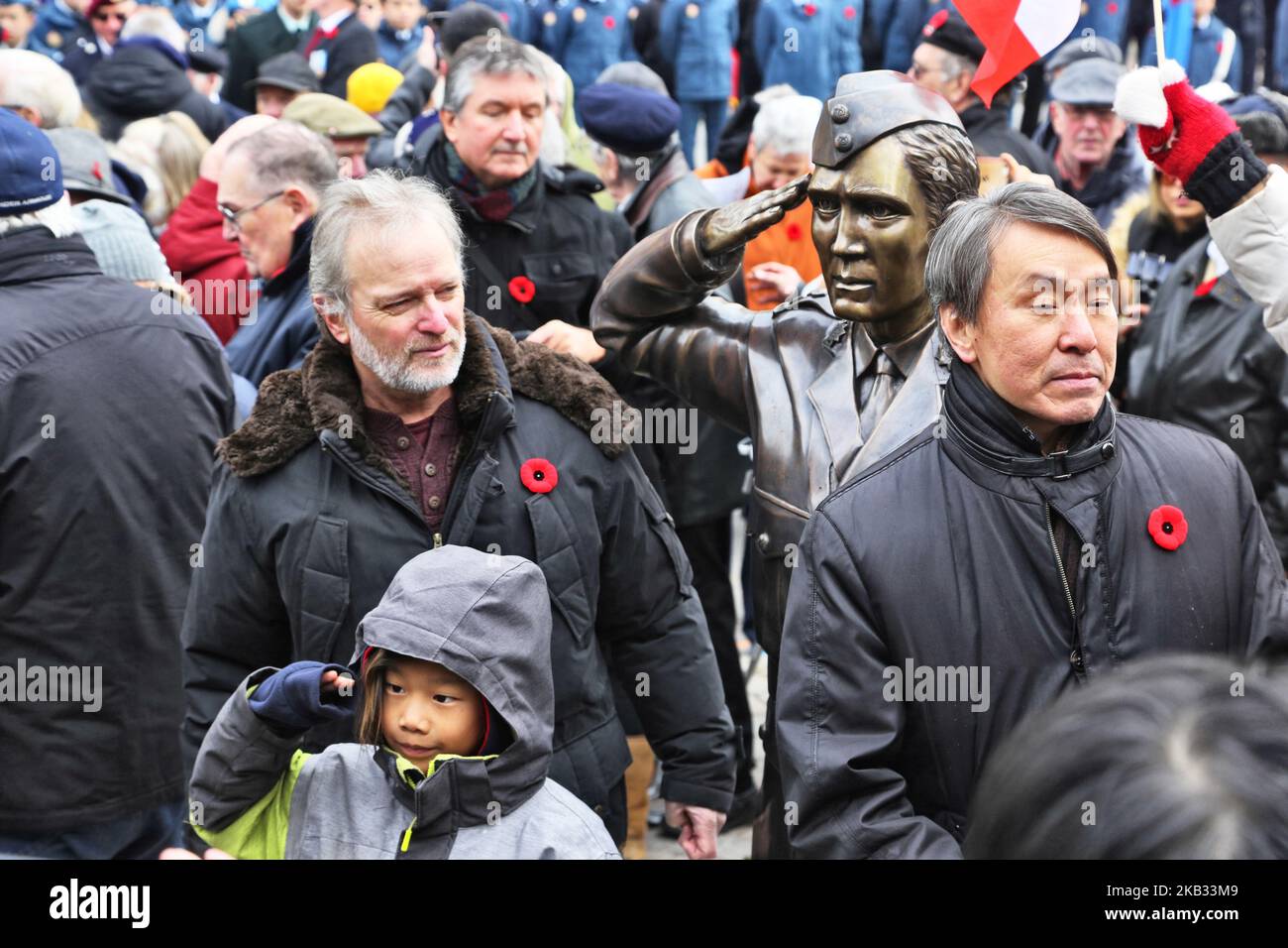 Canadians commemorate members of the military who served in past and ...