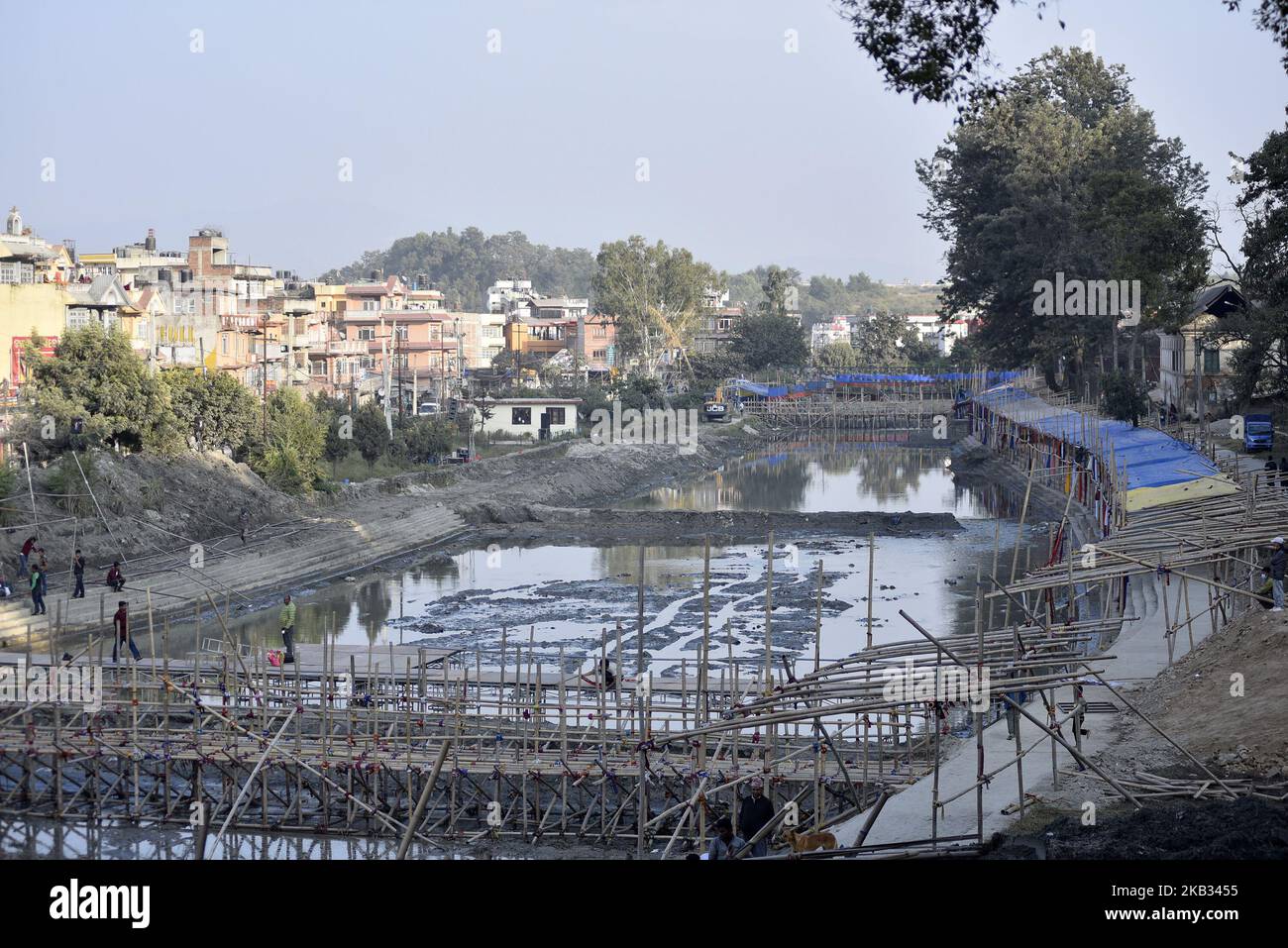 Workers preparing temporary bridge around the bank of Bagmati River for ...