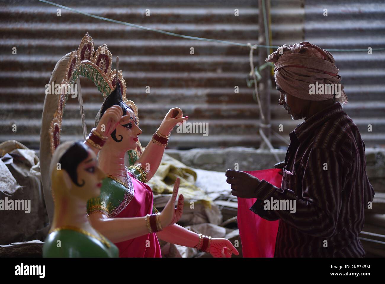 48yrs old Nepalese artist, BIKAU PANDIT gives finishing touches on a ...