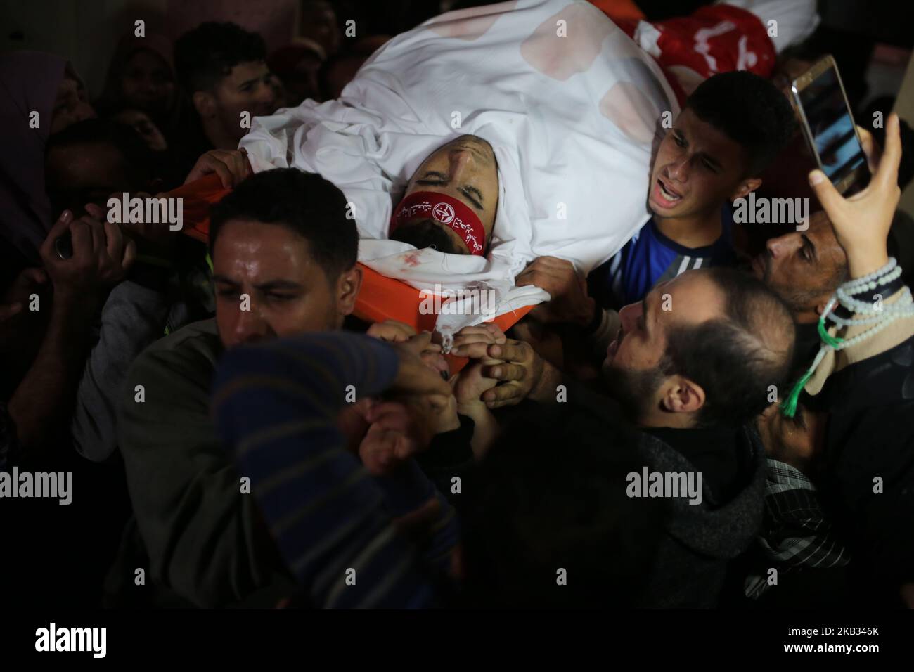 Mourners carry the body of Palestinian militant Mohammed Al Taatri, who ...
