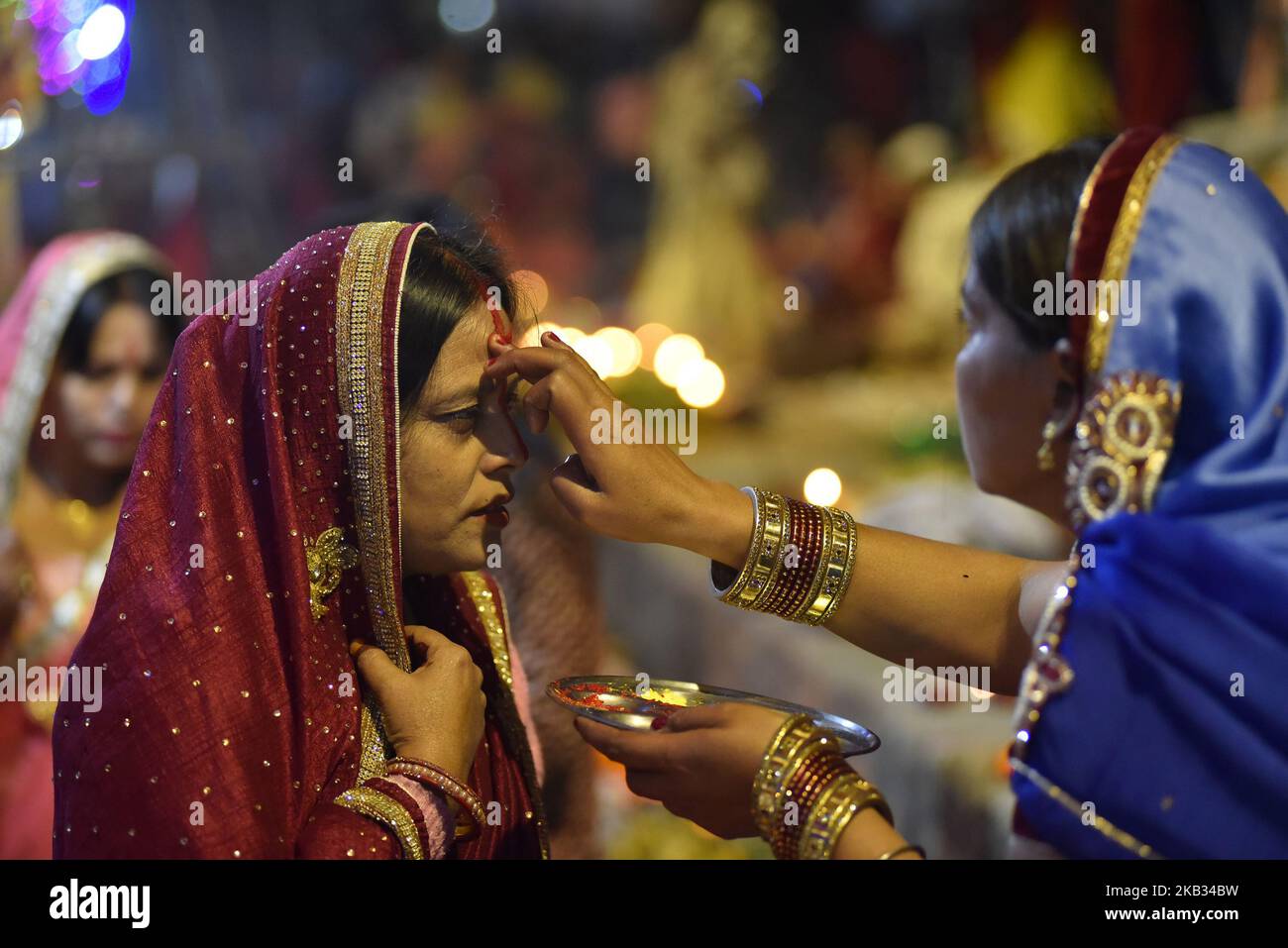 A Devotee offering ritual tika during Chhath Puja Festival at Kamal ...