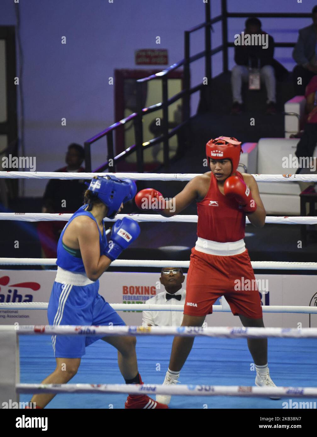 Indian boxer Bhagyabati Kachari (in Red) after her bout against Germany ...