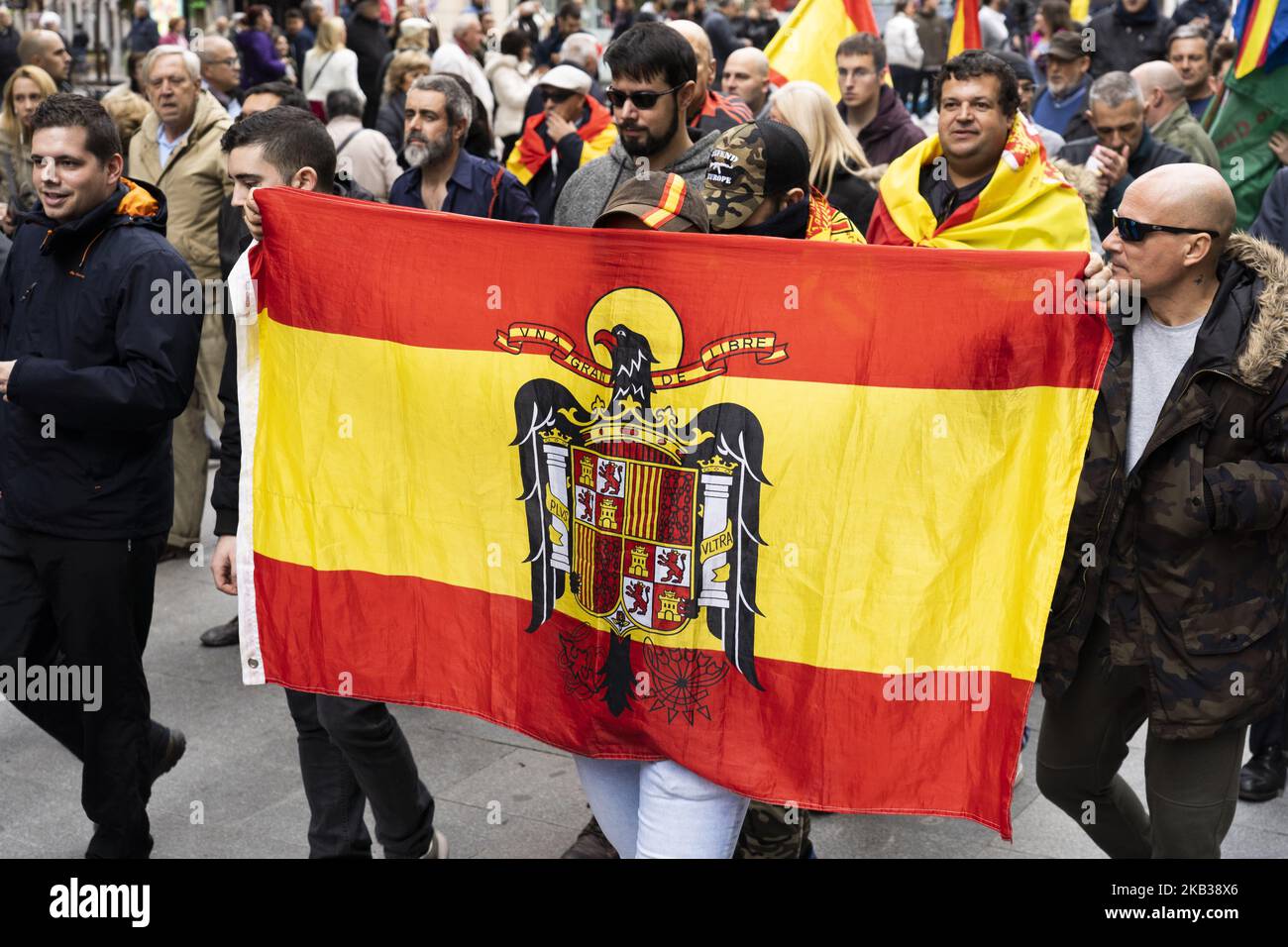 A supporter of Franco wears the pre-constitutional Spanish flag during ...