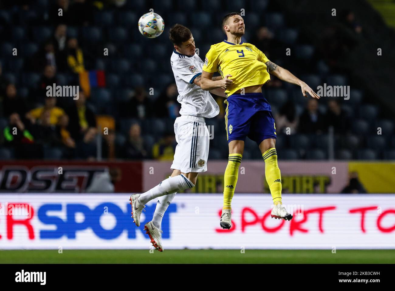 Marcus Berg (R) of Sweden and Roman Neustadter of Russia vie for a ...