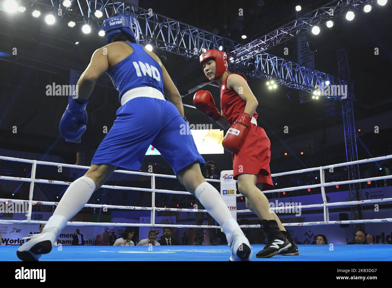 Mary Kom of India (in blue) and Kim Hyang Mi of North Korea (in red ...
