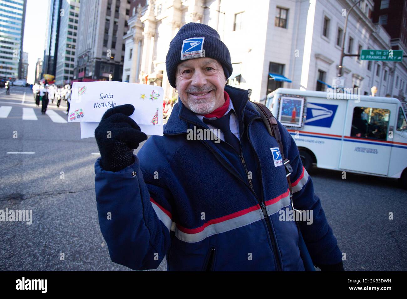 A mail carrier from the U.S. Postal Service collects letters to Santa ...