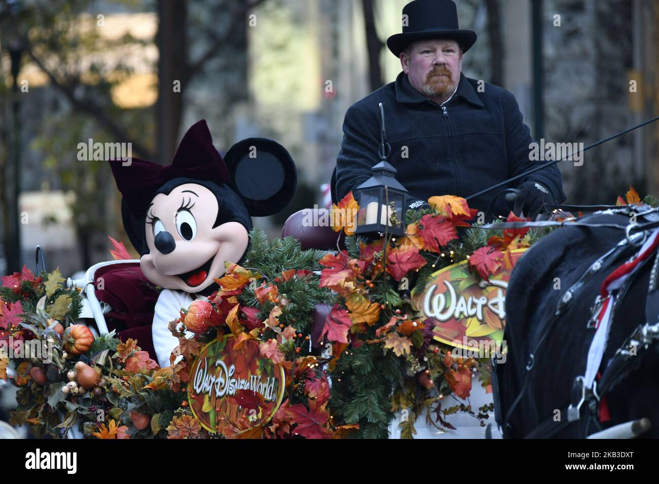 Disney's Mini and Mickey Mouse ride on a Walt Disney World carriage ...