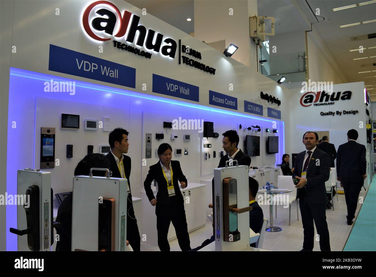 Representatives stand in front of the booth of Zhejiang Dahua ...