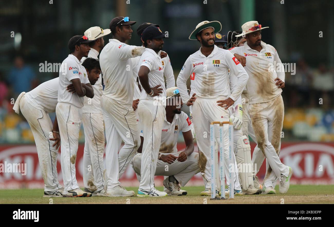 Sri Lankan cricketers look at the big screen during the 1st day's play ...
