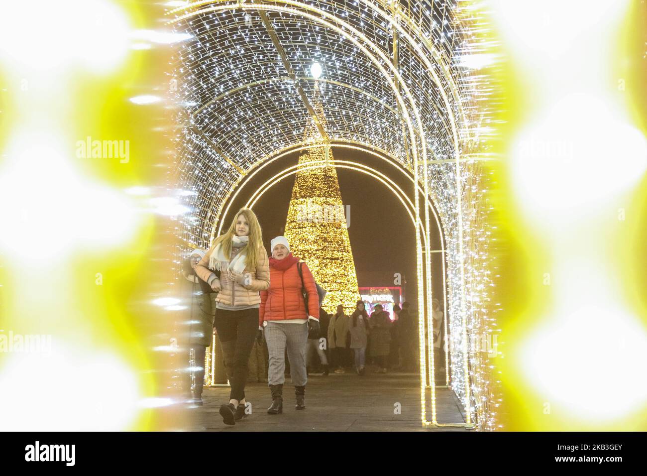 Crowd admiring Christmas tree lights is seen in Gdansk, Poland on 24 ...