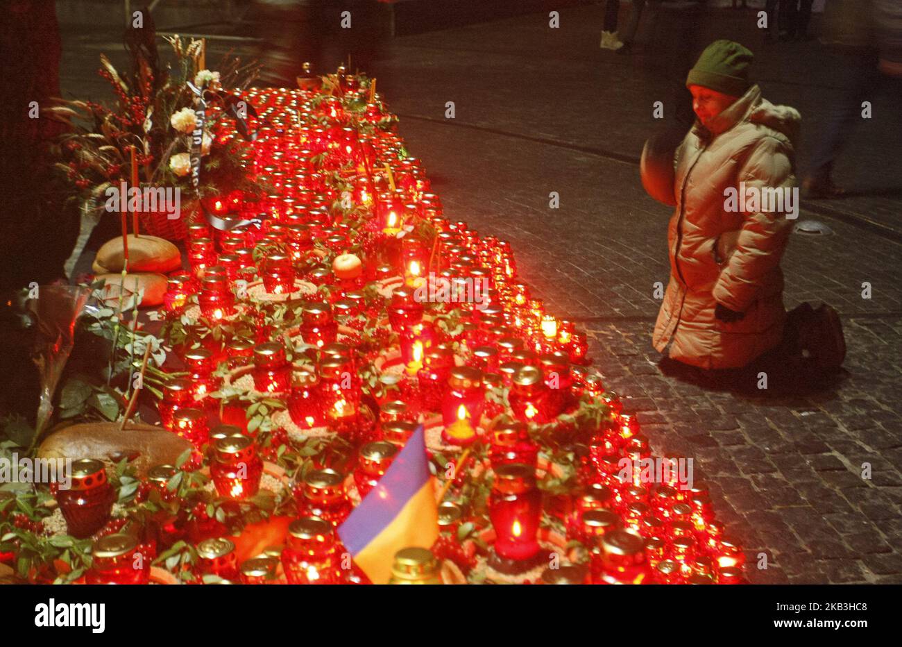 An Ukrainian woman prays in the memory of victims of Great Famine ( the ...
