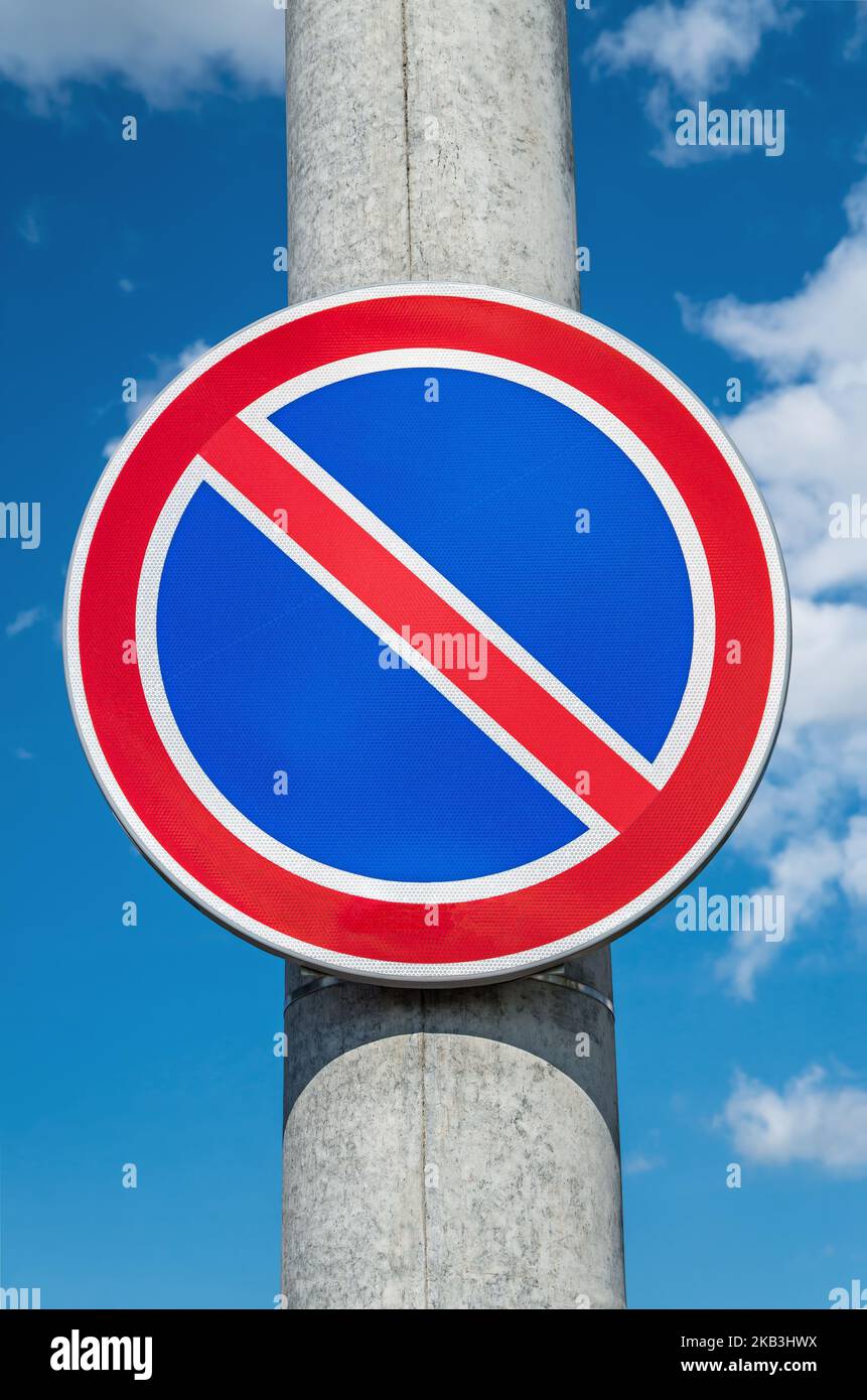 Road sign forbidden stopping hangs on reinforced concrete pole against ...