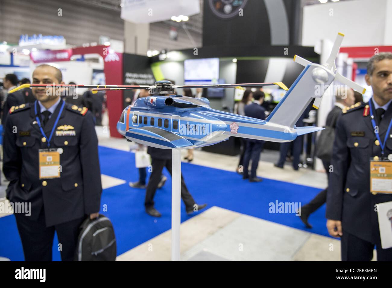 A visitor looks at Lockheed Martin Industries' helicopter model during ...