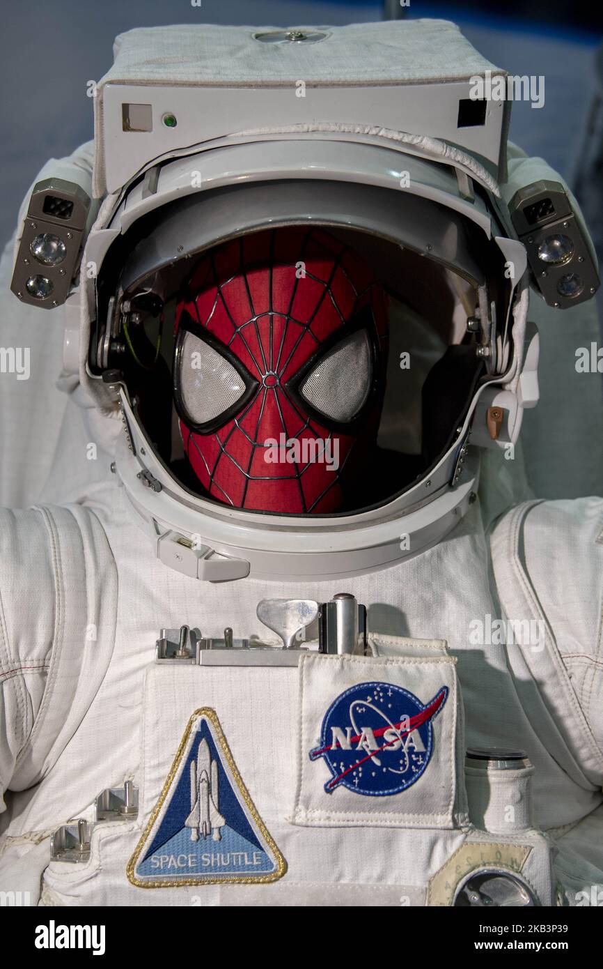 Spider-Man poses for a photograph inside an space suit at Tokyo Comic ...