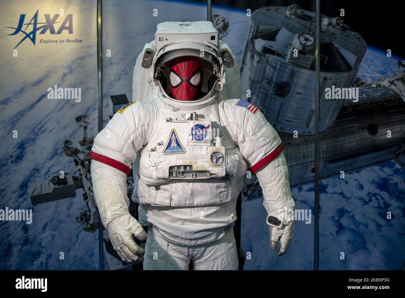 Spider-Man poses for a photograph inside an space suit at Tokyo Comic ...