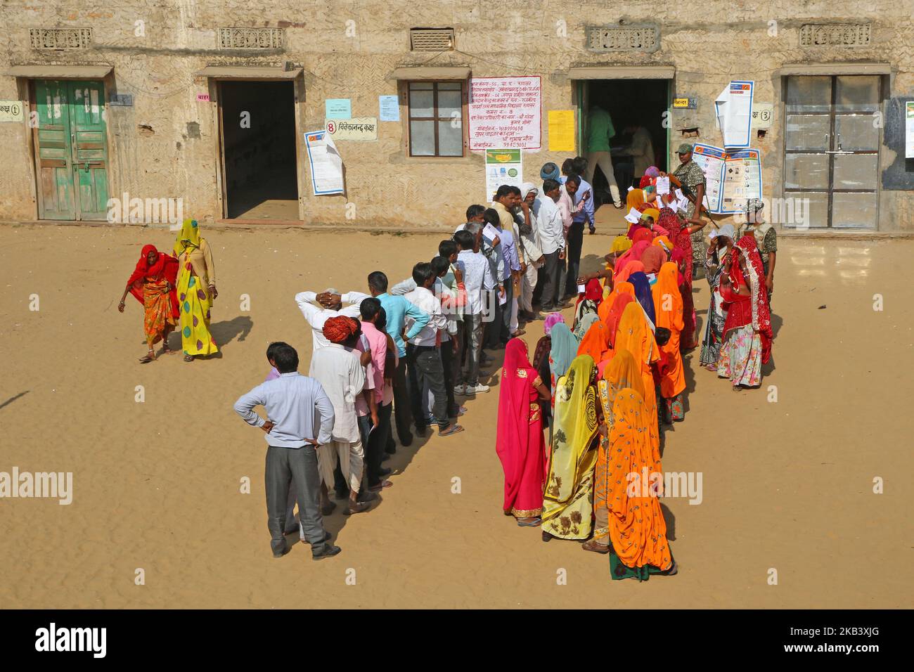 Village women stand in queue hi-res stock photography and images - Alamy