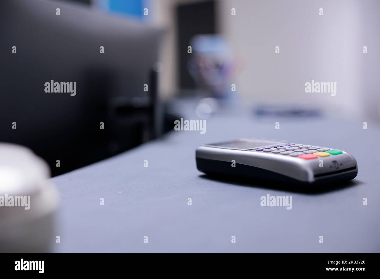 Bank terminal on desk in cashier area of medical institution ...