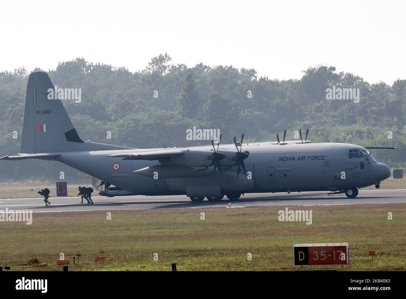 Indian special force commandos land on a runway from a moving C-130 ...
