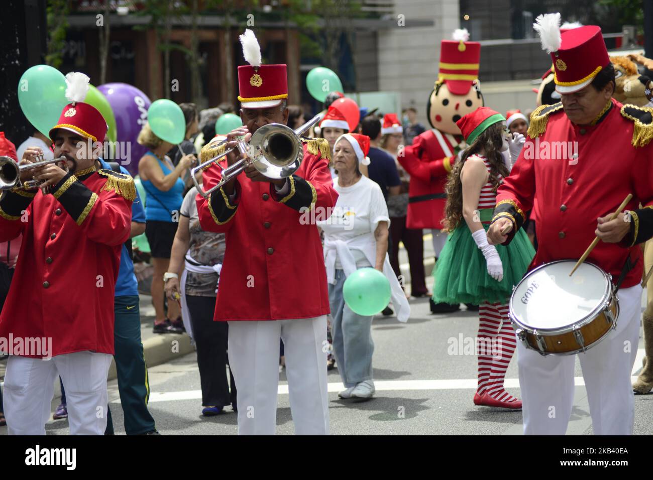 People take part in a Christmas flash mob through streets in Sao Paulo ...