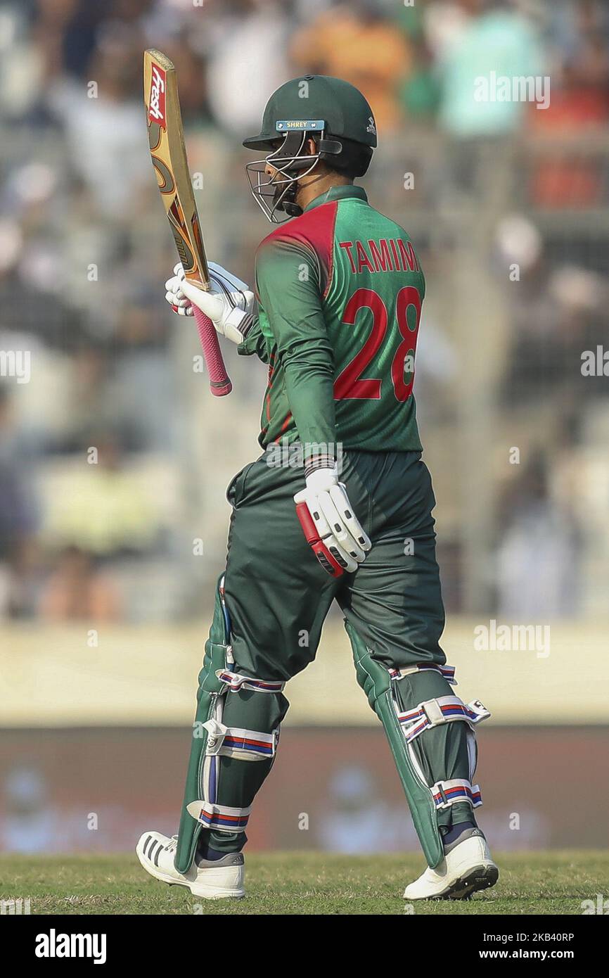 Bangladeshâ€™s Tamim Iqbal rais the bat to celebrate after scoring a ...