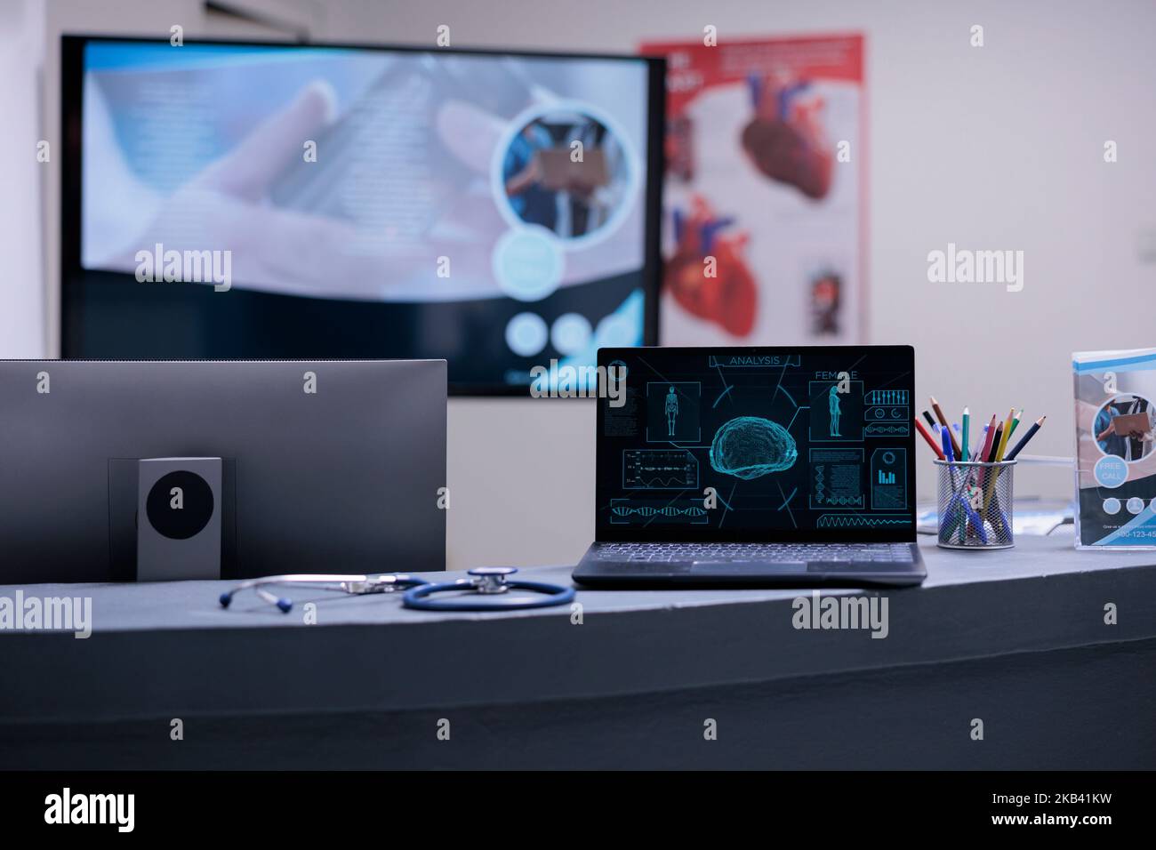 Tomography displayed on laptop screen in medical clinic desk. Brain x ...