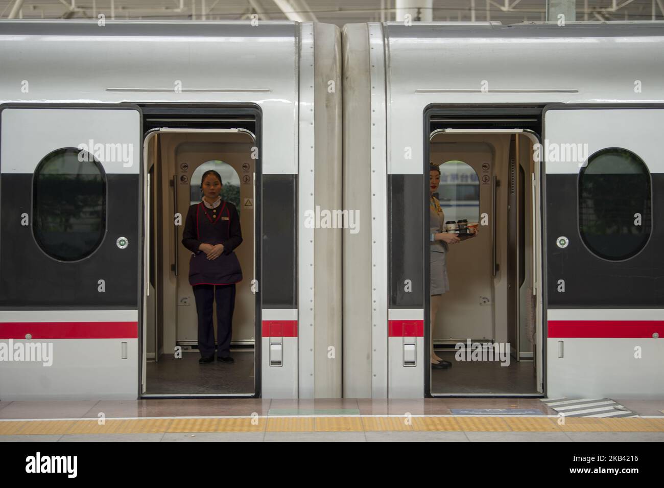 A High speed train (HSR) is parked at a platform in Shenzhen North ...